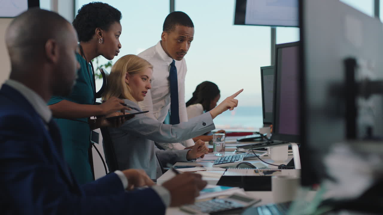 Business woman team leader meeting with colleagues using computer ...