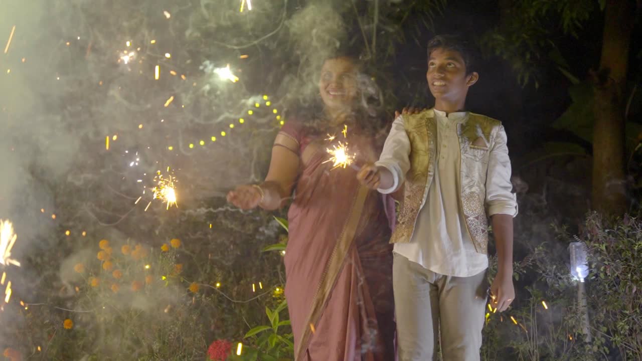 Diwali celebrating a Family Family Bursting Firecrackers in Diwali ...