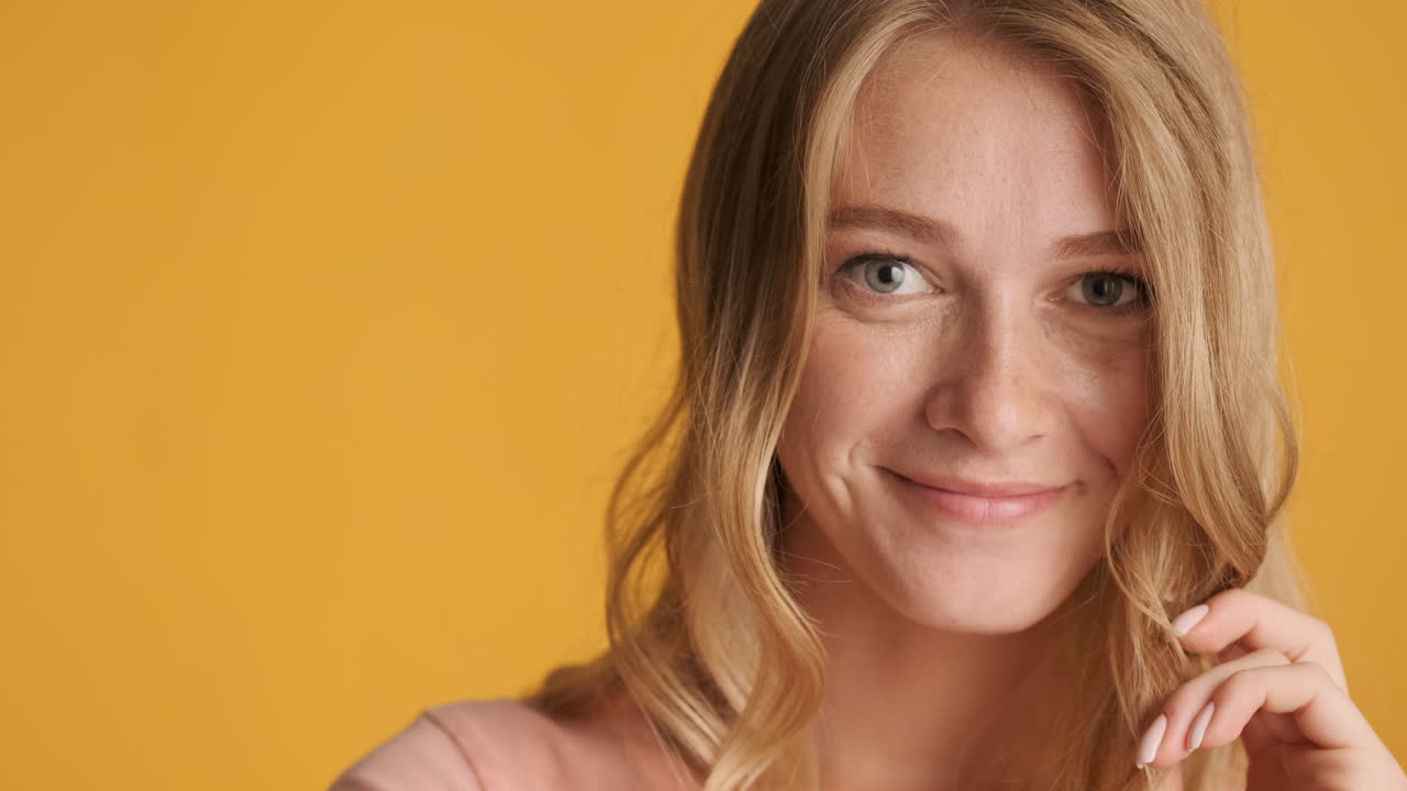 Free stock video - Caucasian woman showing flirting gestures on camera.