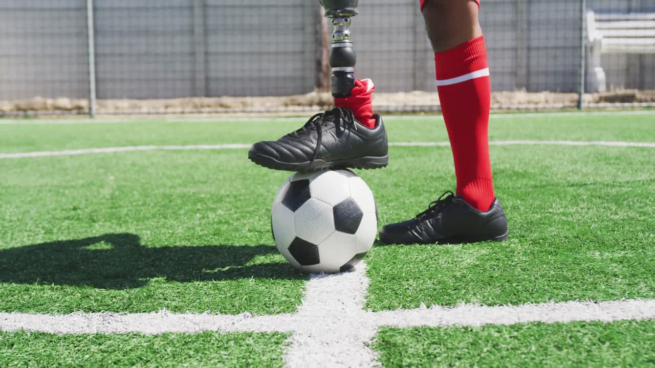 Soccer player with prosthetic leg on field Premium Stock Video Footage