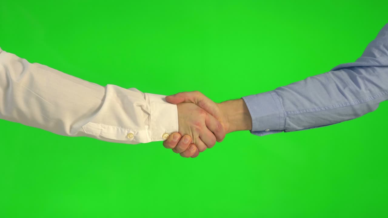 Handshake on a green background in 4k slow motion 60fps | Premium Stock ...