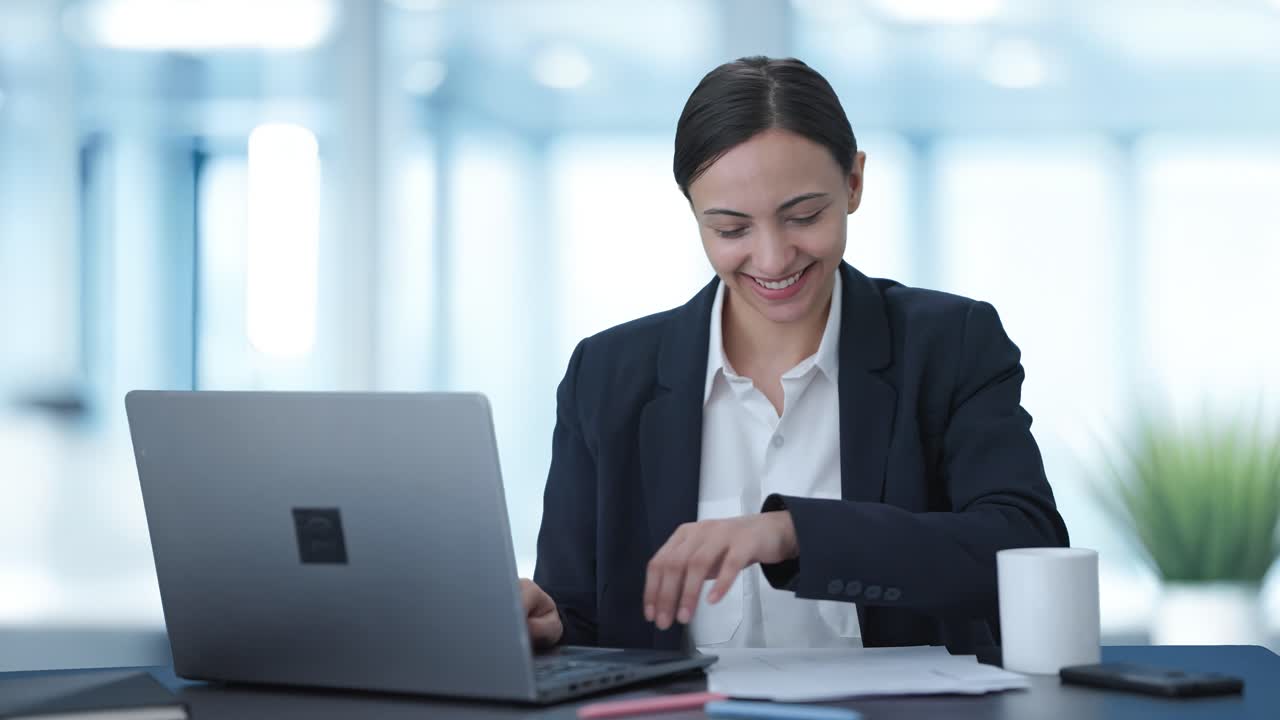 Premium stock video - Happy indian female manager starting working