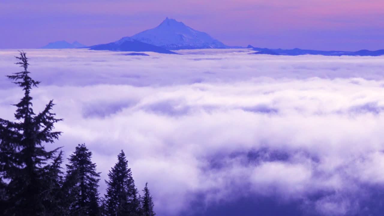 Time lapse of clouds moving across the oregon cascade range with mt ...