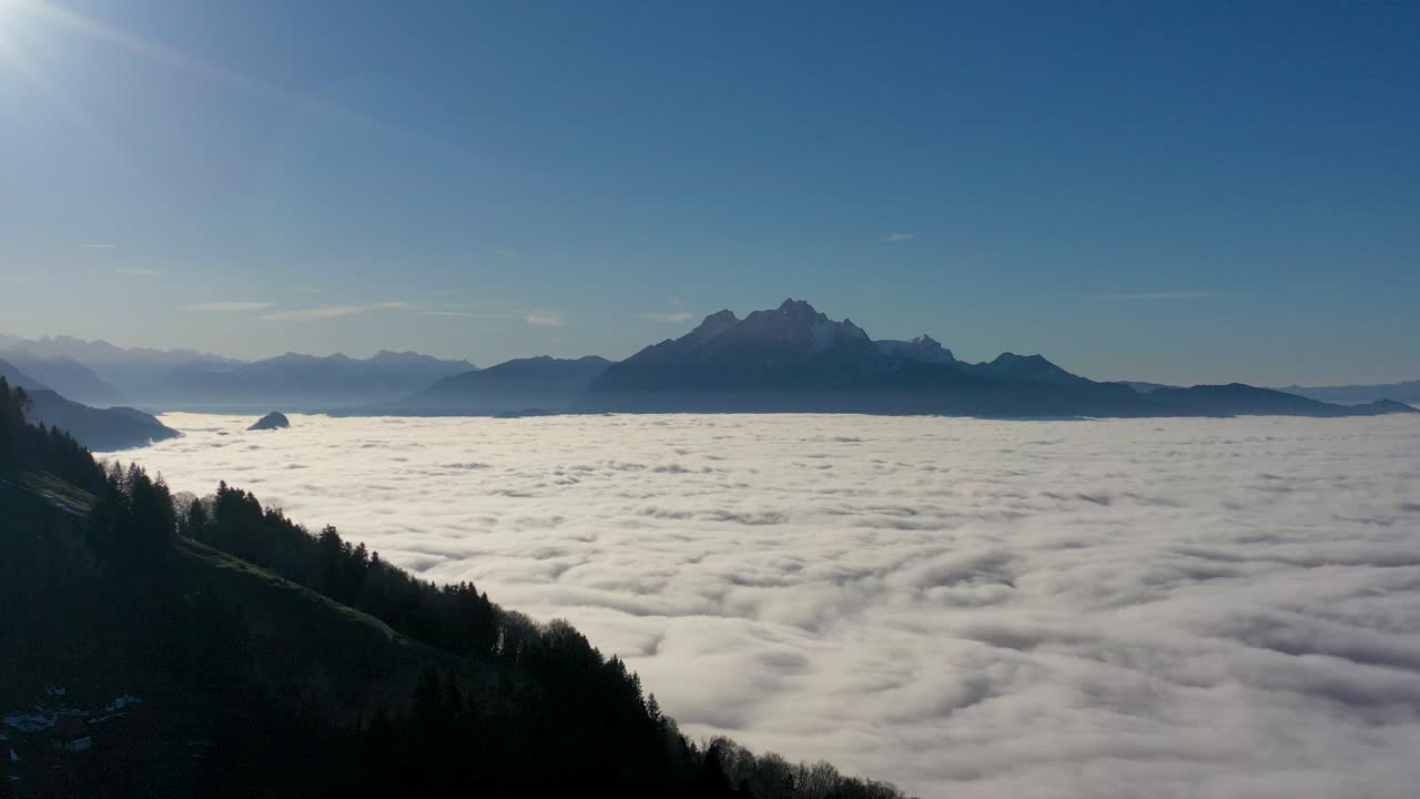 Drone pans left-to-right above Nebelmeer fog layer inversion phenomena ...