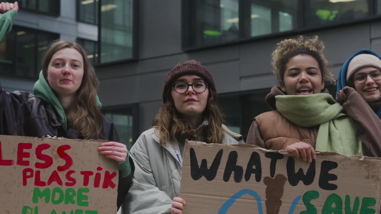 Group Of Young Female Activists With Banners Protesting Against Climate ...