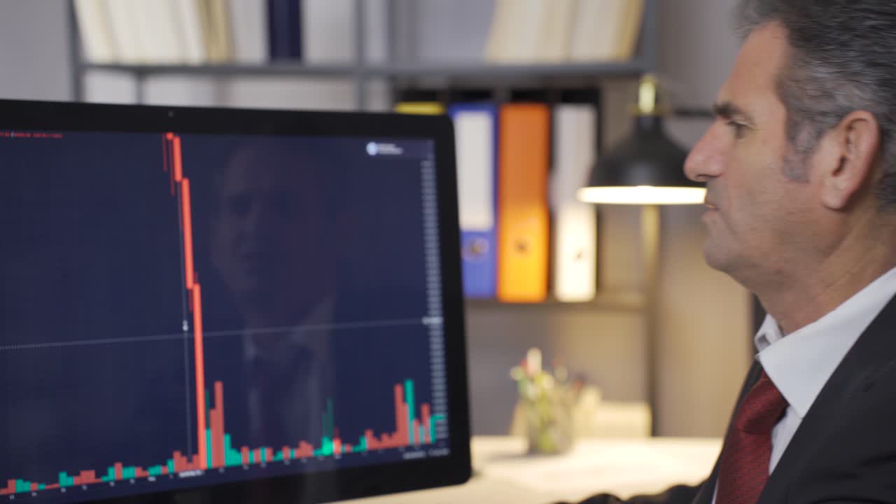 Premium stock video - The stressed and angry stock trader is losing and ...