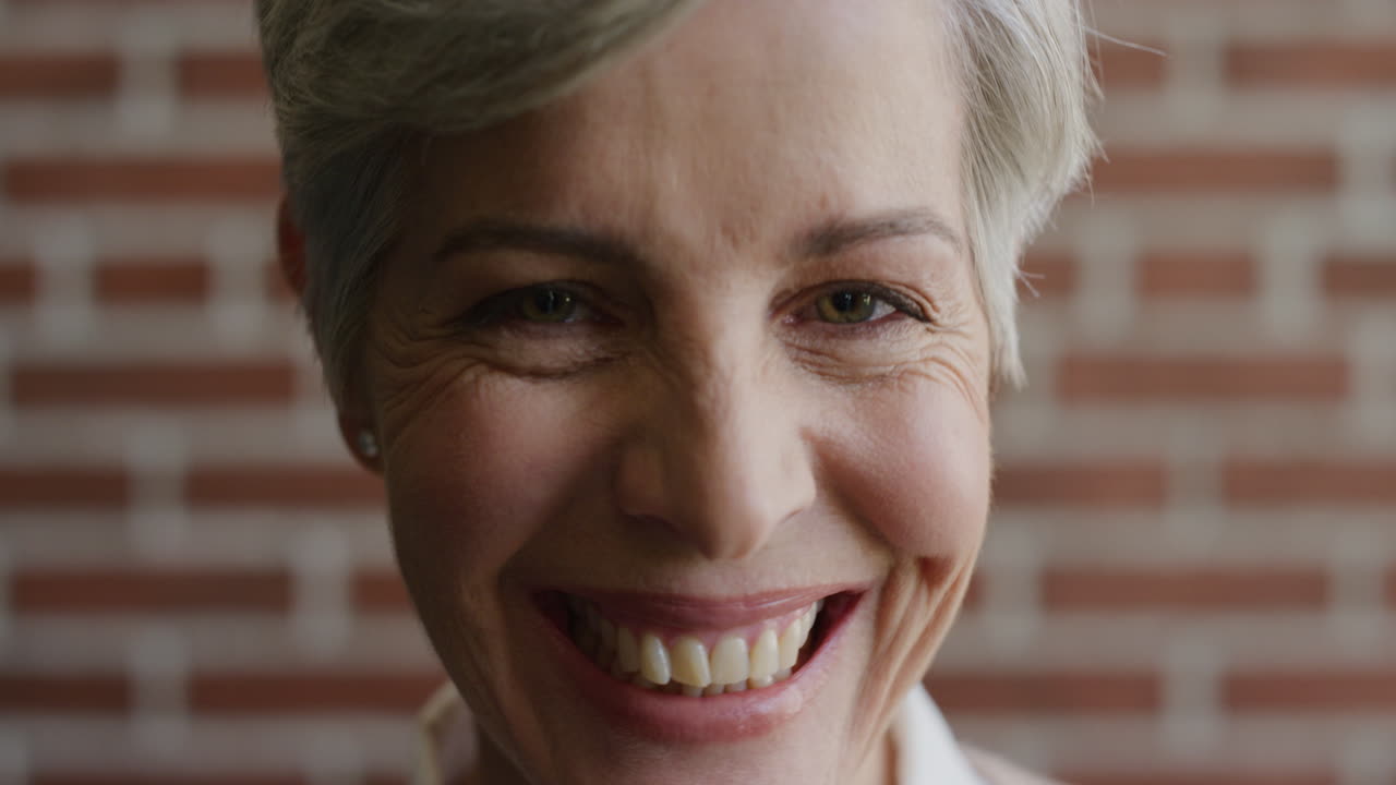 Premium stock video - Close up portrait beautiful middle aged woman laughing enjoying happy ...