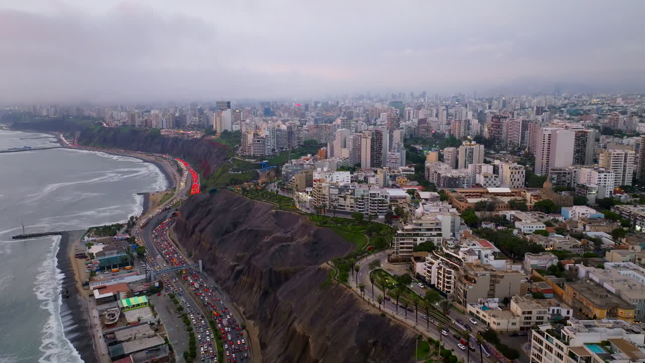 Lima cityscape and Costa Verde highway at dusk, heavy traffic, coastal ...