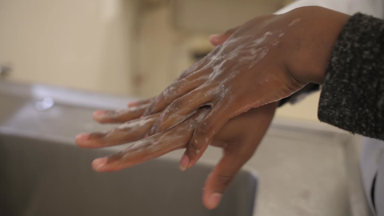 Premium stock video - Proper hand washing technique, step 3: palm to ...
