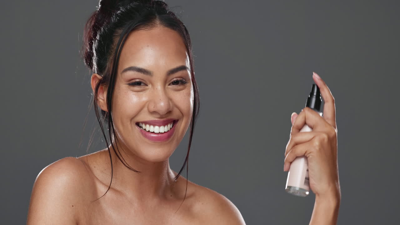 Premium stock video - Face, woman and spray after makeup studio