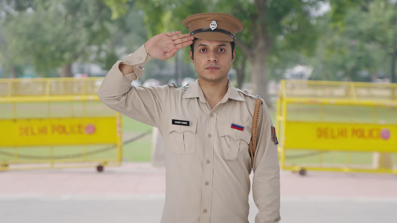Premium stock video - Proud indian police officer saluting