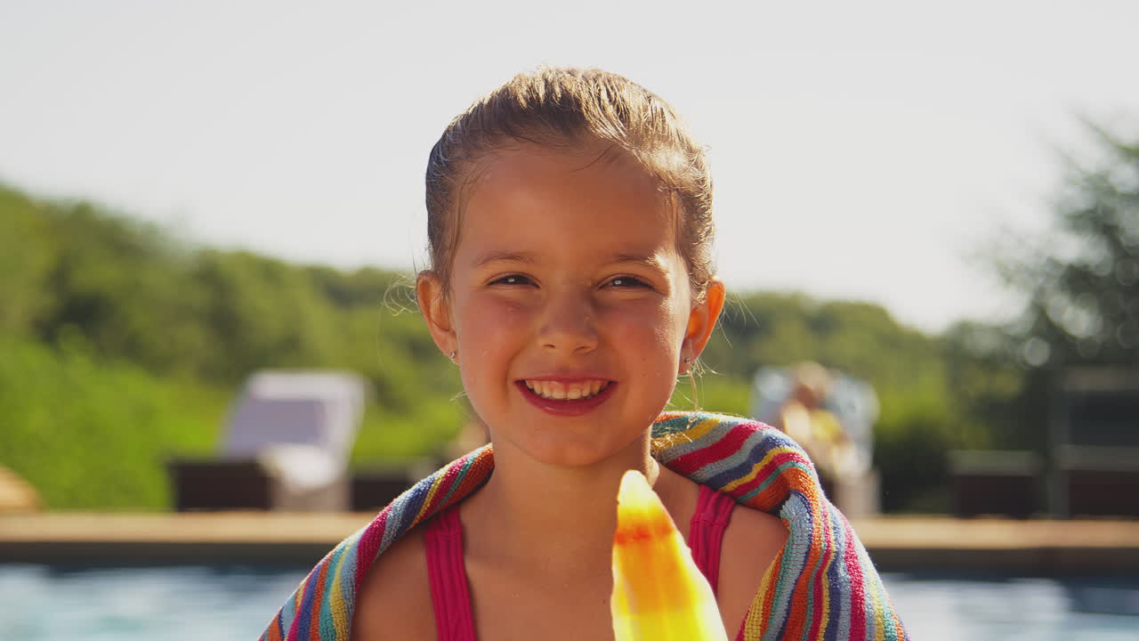 Premium stock video - Family on summer holiday with girl eating ice ...