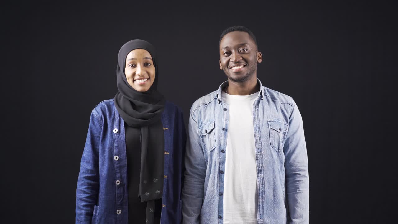 Premium stock video - Happy african muslim couple laughing and holding ...
