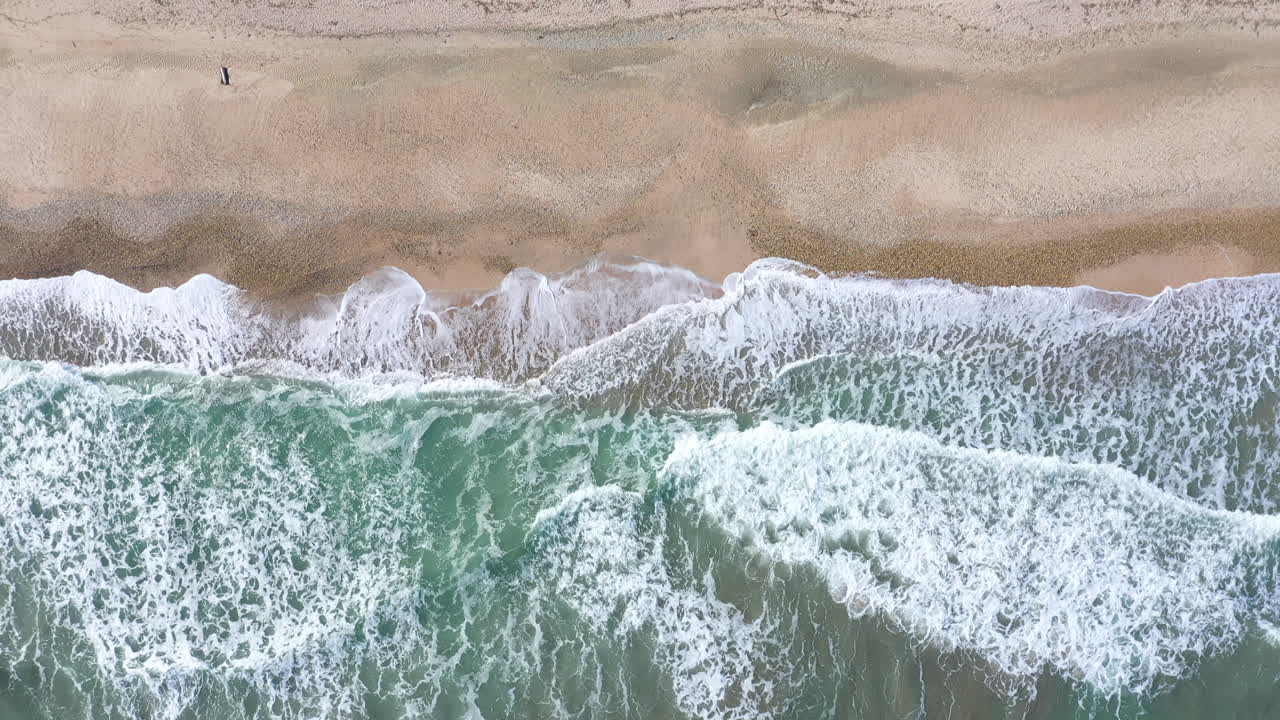 Free stock video - Top shot view over the sea shore on a sandy and ...