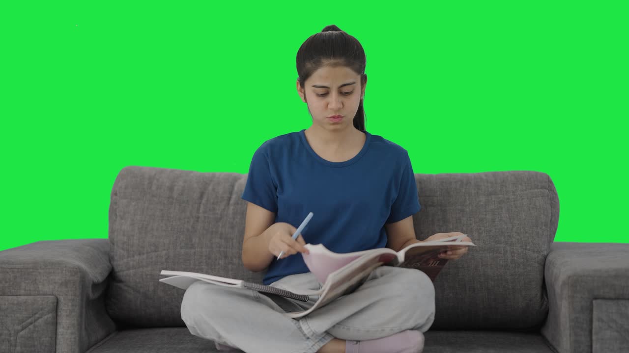 Premium stock video - Indian teenage girl preparing for exams in a rush ...