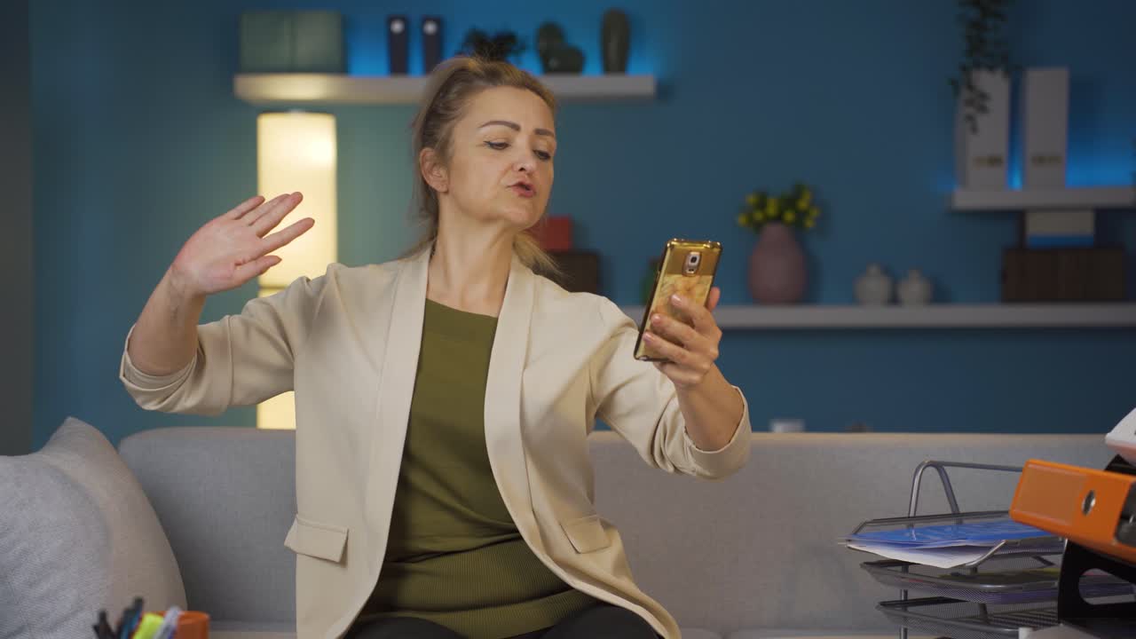 Premium stock video - Freelance woman dancing fun and happy at home.