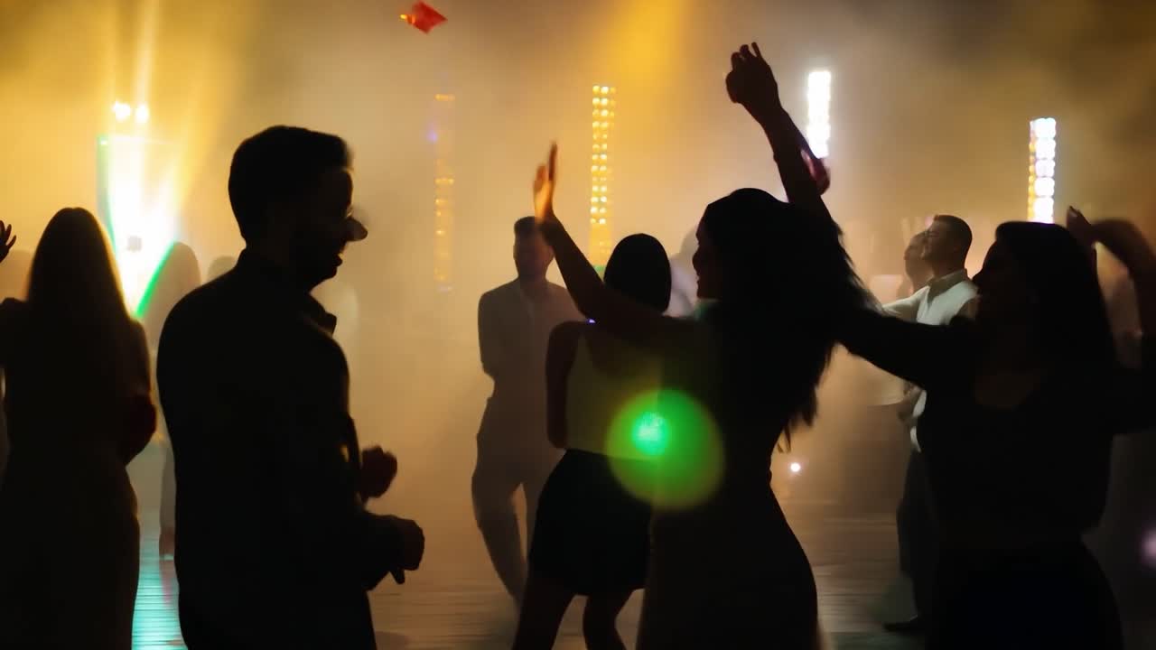 People dancing at a party with confetti Premium Stock Video Footage
