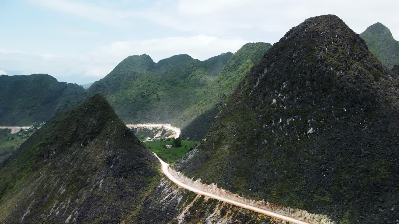 Premium stock video - The long, winding, narrow road through lung phin ...