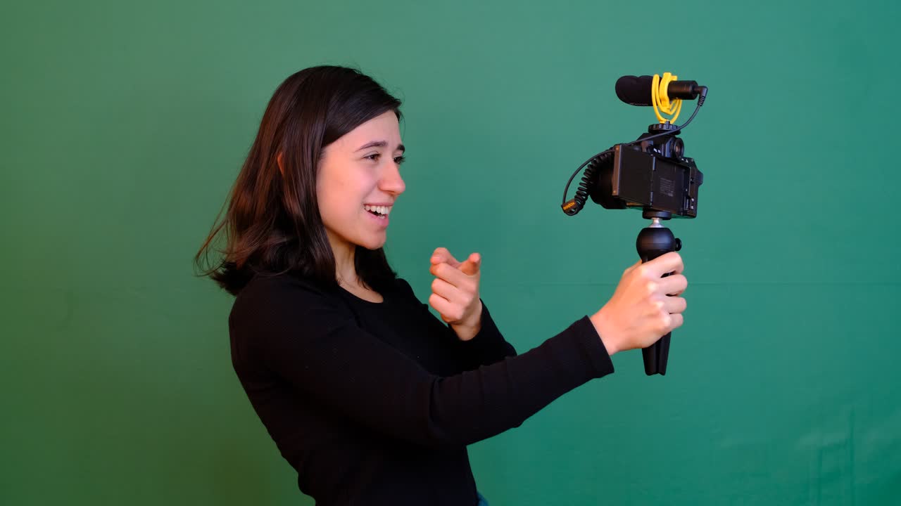 Premium stock video - Influencer girl talking to camera