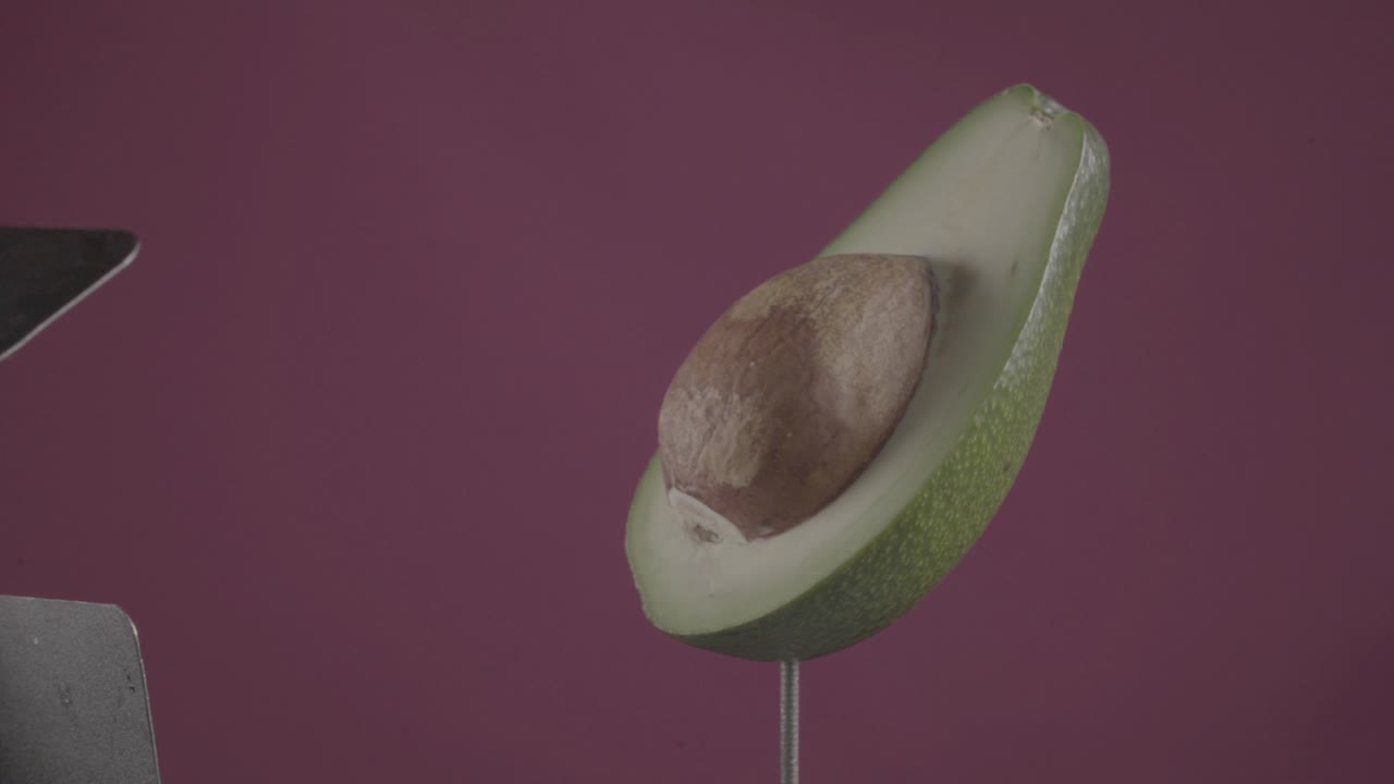 Avocado rotating with loop on fuchsia screen for chroma key | Premium ...