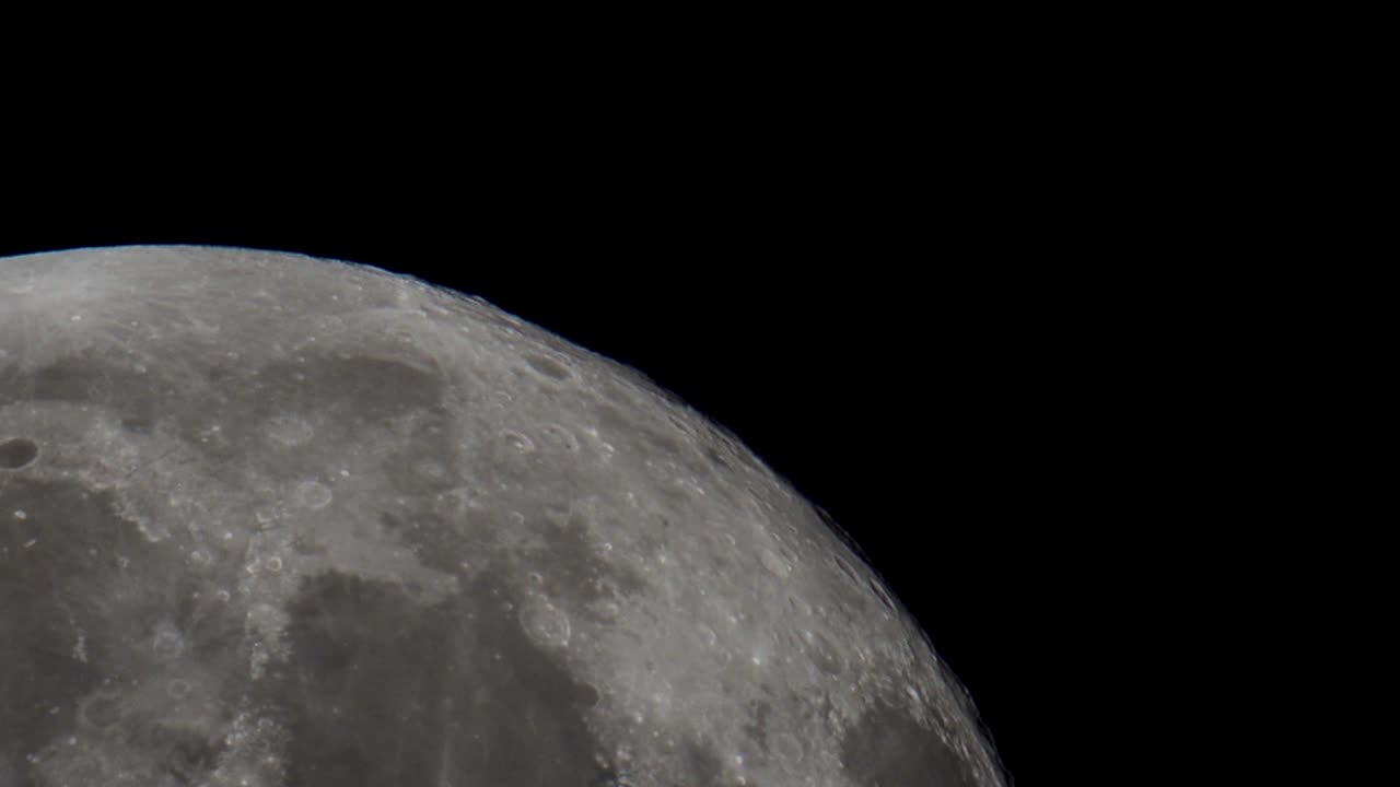 Premium stock video - A super telephoto video of the giant full moon ...