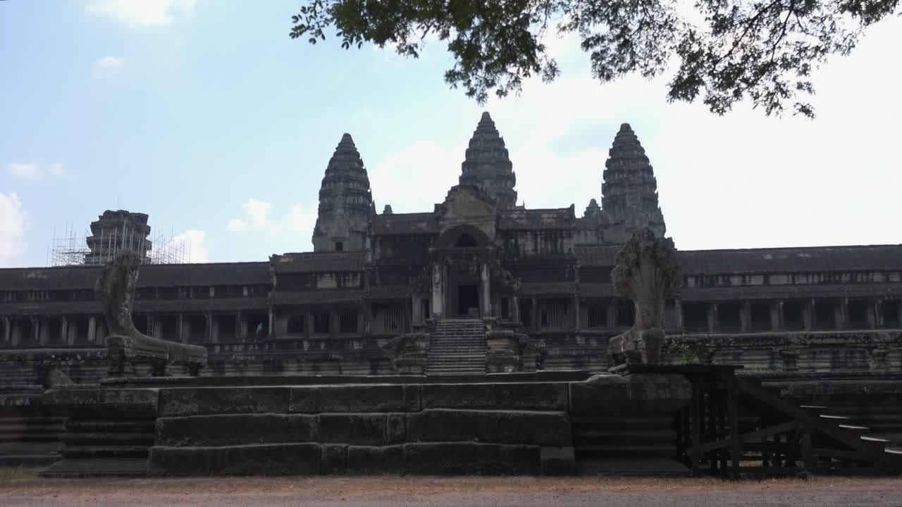Wide Exterior Pan Right Shot Of The Three Towers Of The Ancient Angkor ...