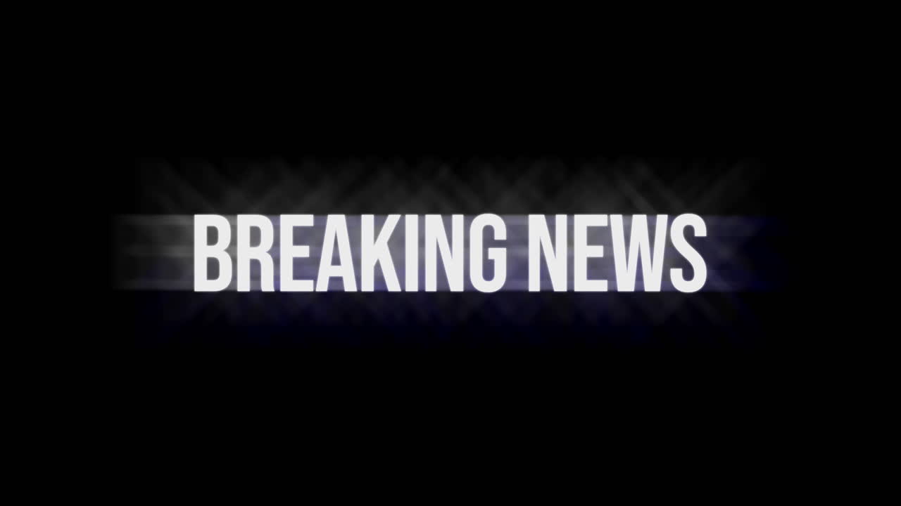 The headline breaking news, appearing on the screen with a bright ...