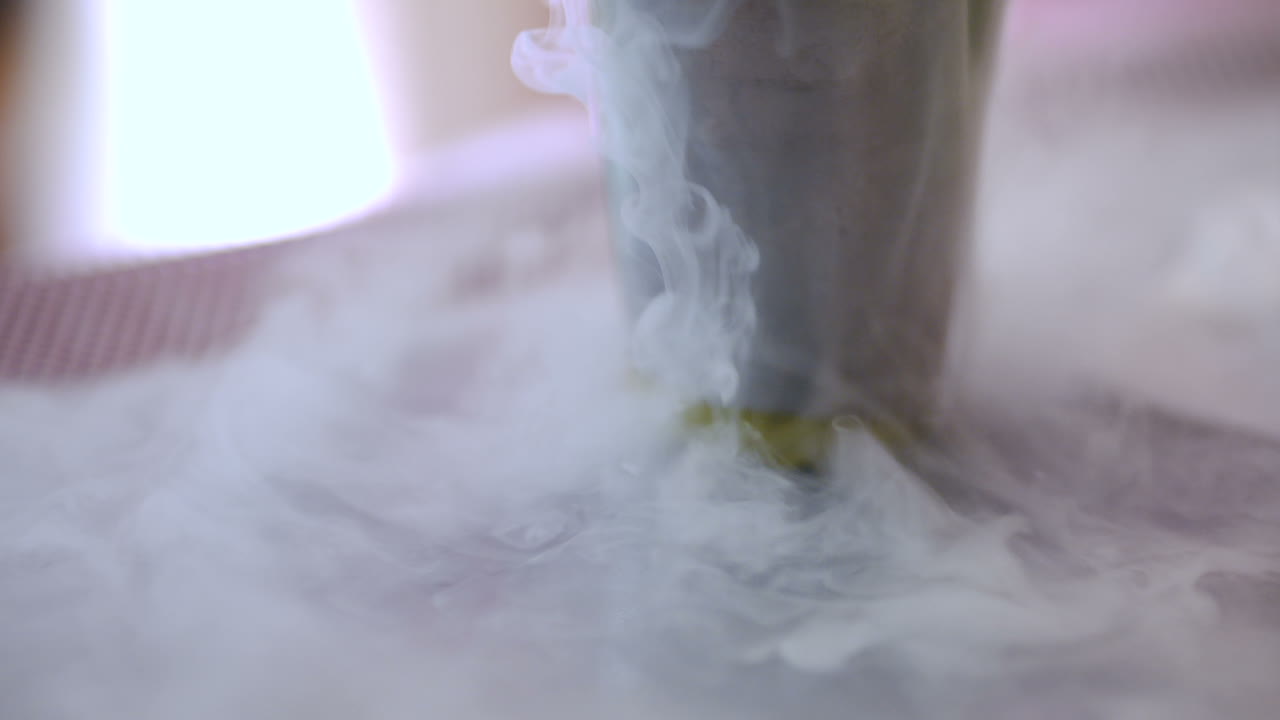 Premium stock video - Dry ice in glass while bartender preparing drink 4