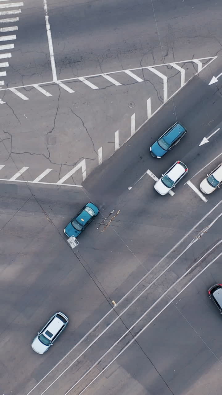 An urban intersection with vehicles and pedestrians seen from above ...