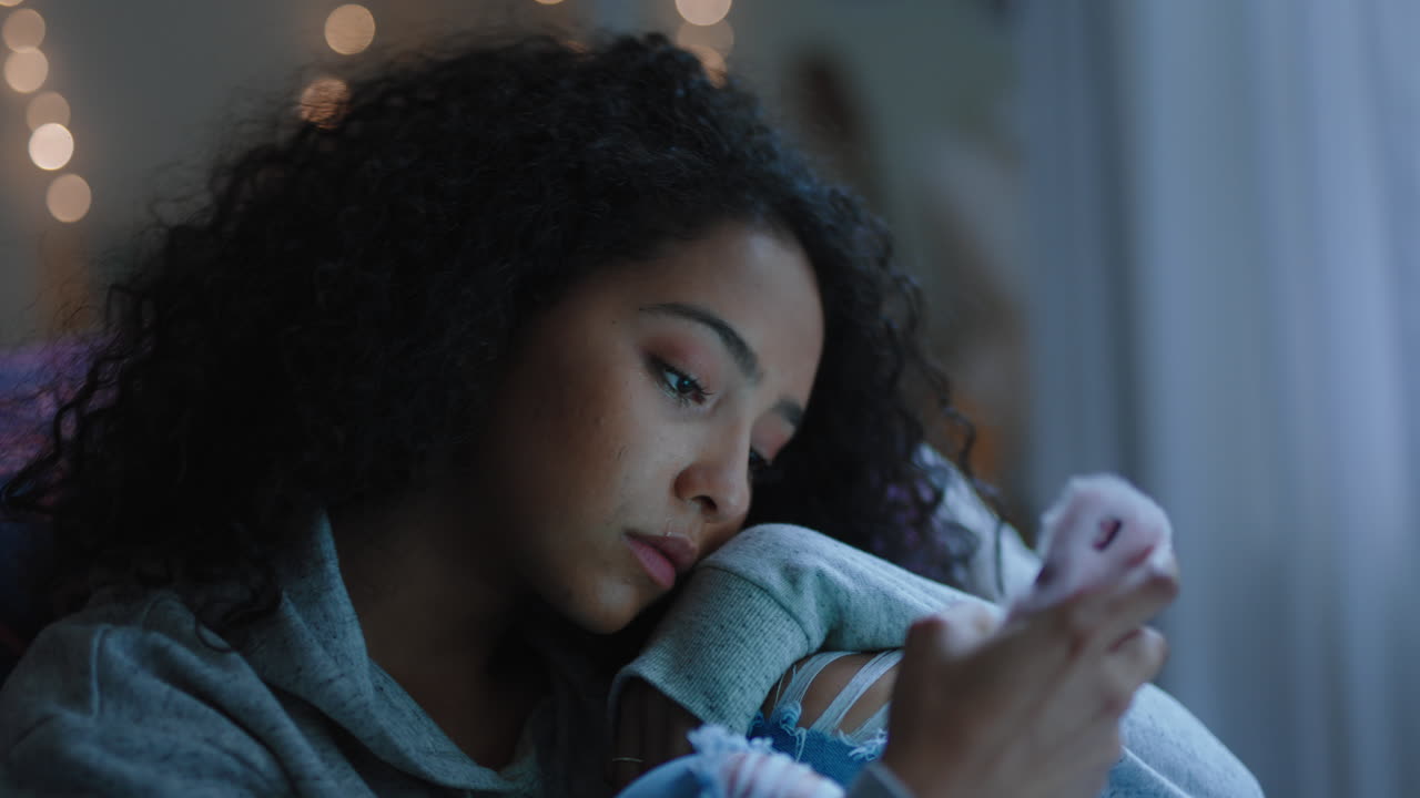 Sad teenage girl crying at home feeling alone depressed teen thinking ...