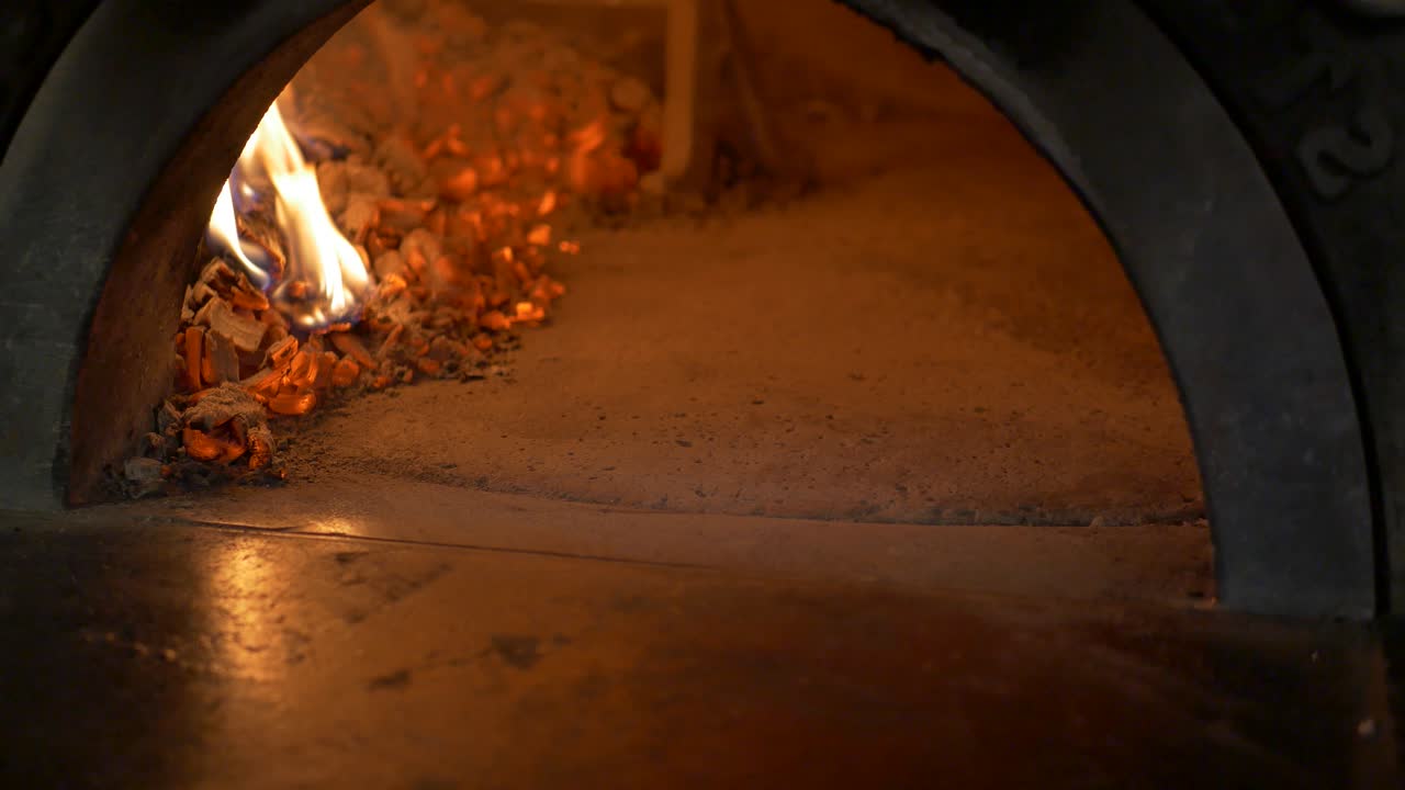 Premium stock video - Fire in pizza wooden oven 4k