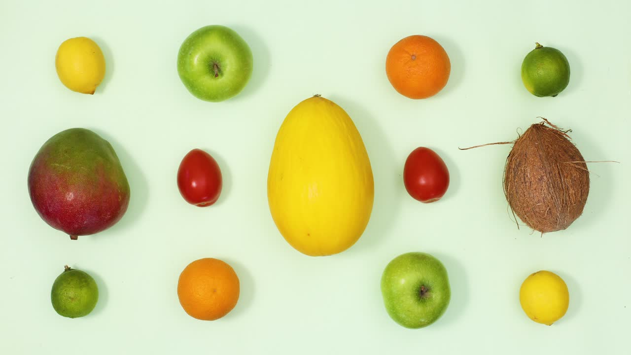 Exotic summer fresh ripe fruits layout move on light green background ...
