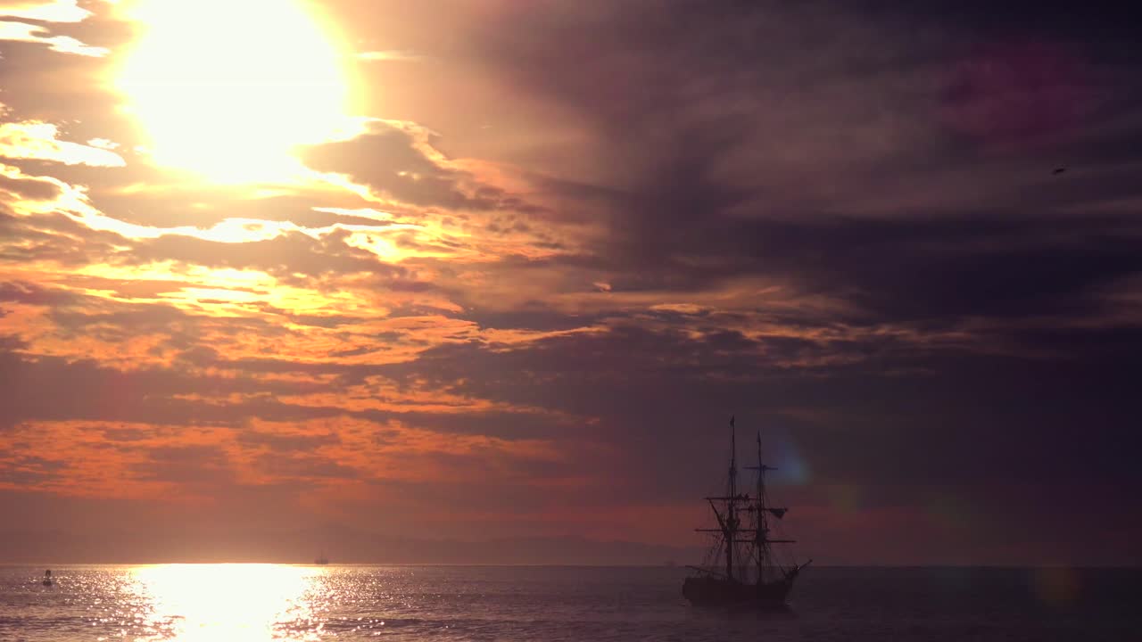 A tall clipper ship sails at sunset 3 | Premium Stock Video Footage