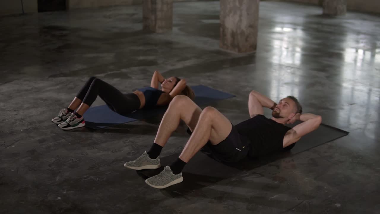 Premium stock video - Young stylish man and woman in sportswear ...