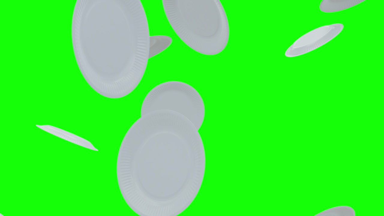 Disposable bagasse plates falling on green screen with alpha matte ...