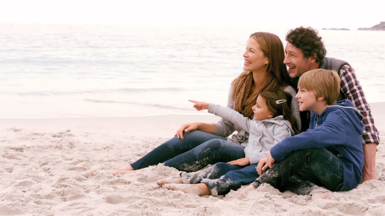 Premium stock video - Family sitting and pointing