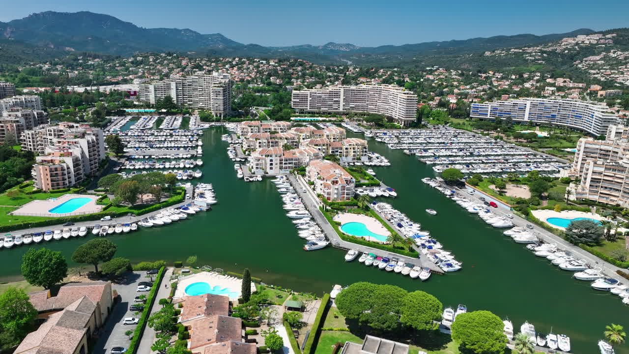 Free stock video - Luxury yachts glisten in the pristine waters of mandelieu-la-napoule's marina