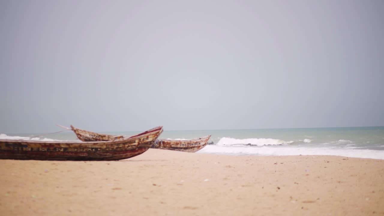Two empty fishing boats moored at the seashore of the atlantic ocean on ...