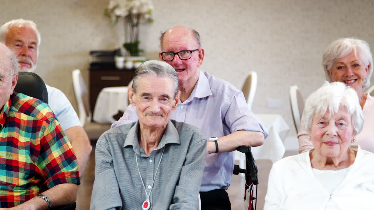 Portrait Of Senior Residents Of Retirement Home Sitting In Lounge ...