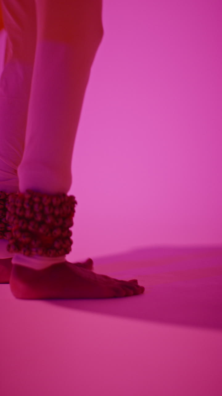 Free stock video - Vertical video close up of feet with bells of female ...