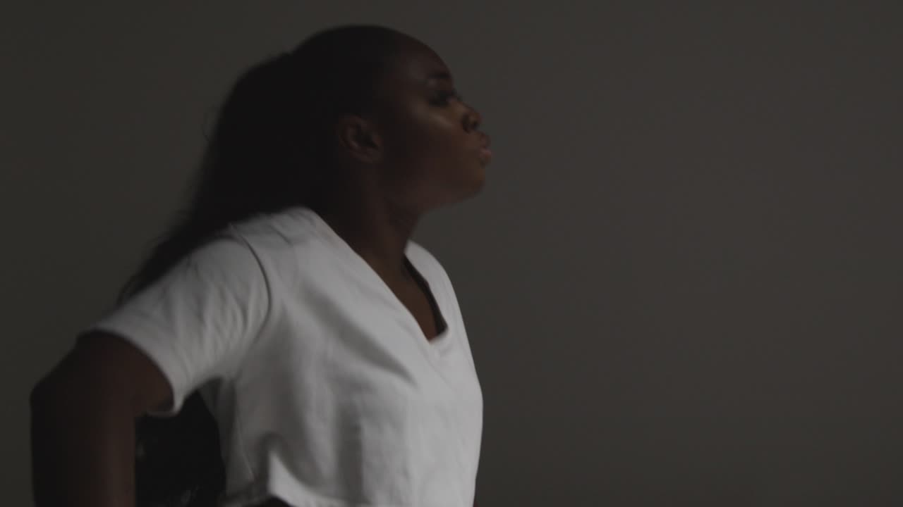 Free stock video - Profile studio shot of young woman dancing with low ...