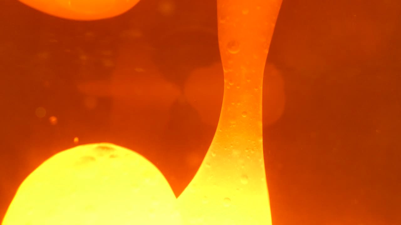 Premium stock video - Yellow and orange lava lamp background, close up ...