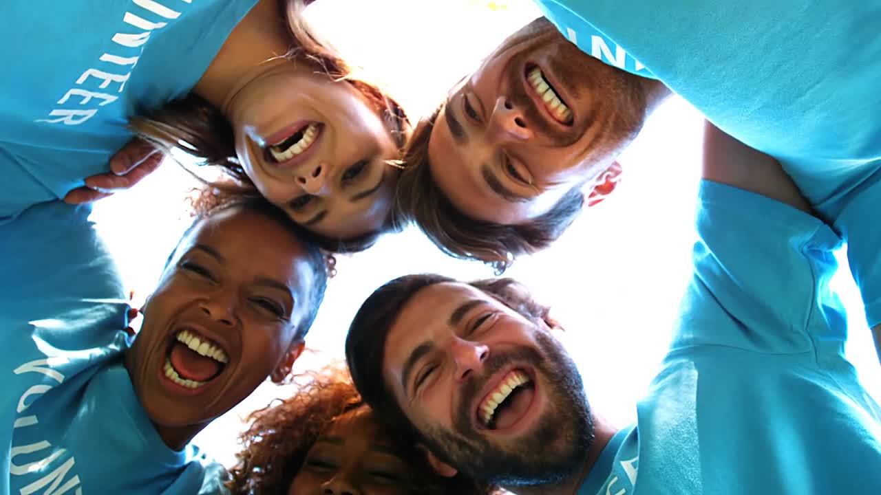 Group of volunteers forming huddles | Premium Stock Video Footage