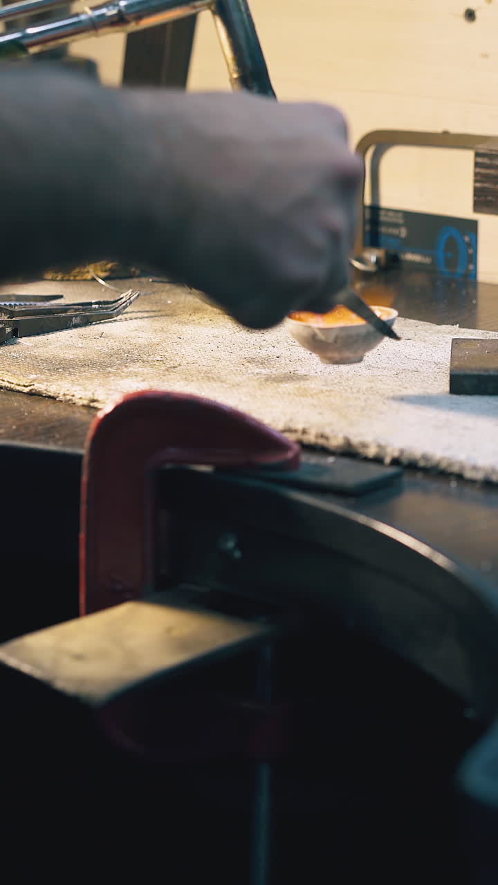 CU shot: jeweler melts metal in special crucible with gas burner at ...