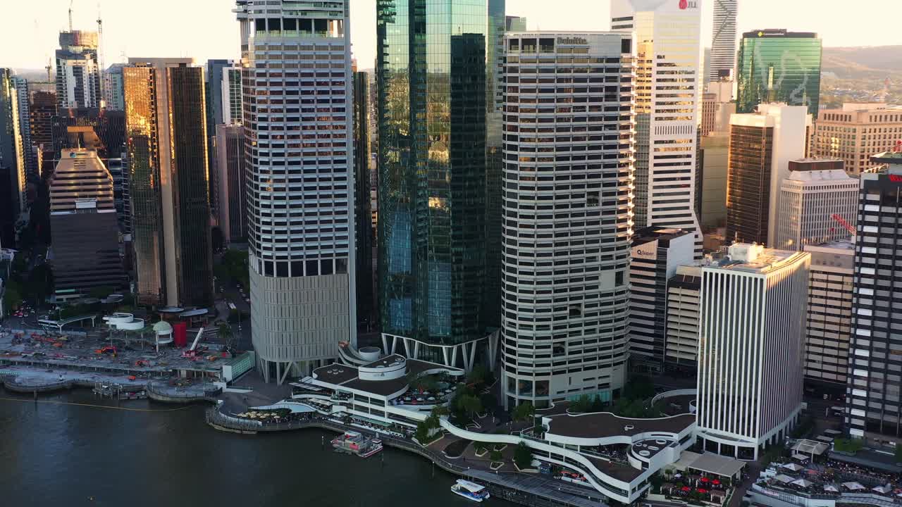 Establishing aerial shot, slow panning up at city reach boardwalk at ...