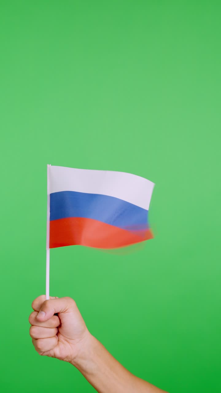 Hand lifting a russian pennant while waving by the wind | Premium Stock ...