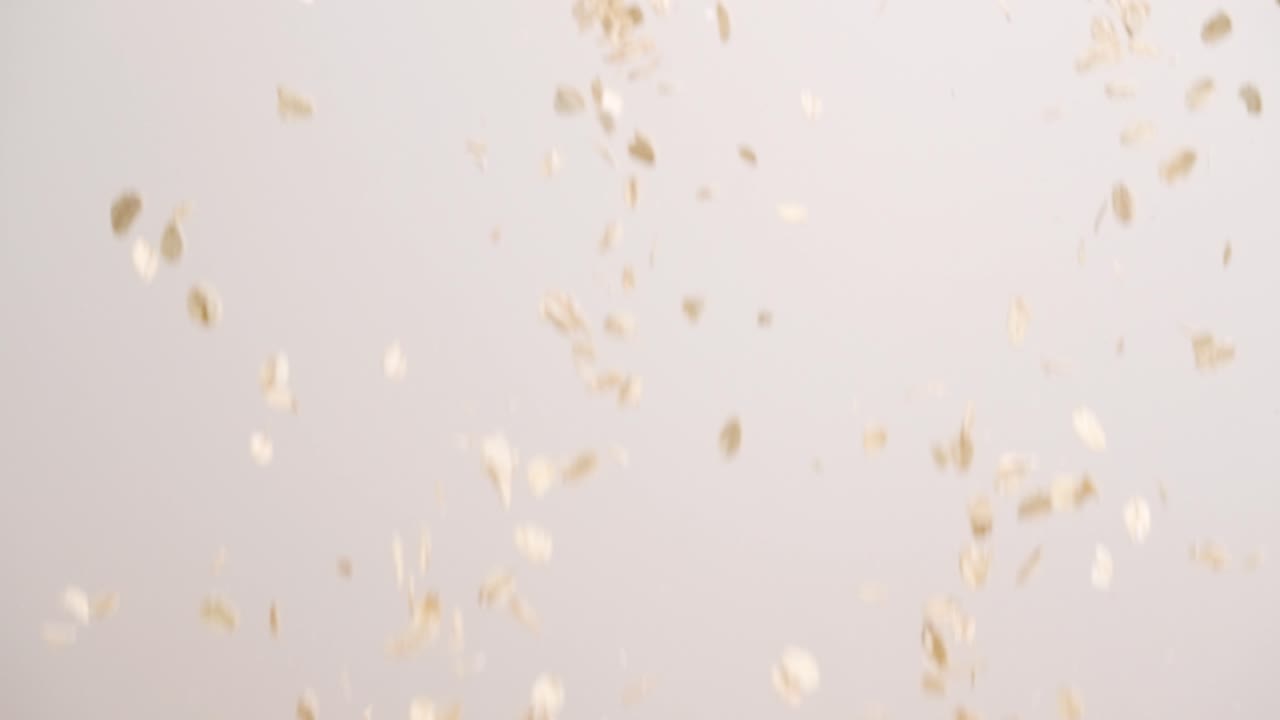 Premium stock video - Oatmeal falling in slow motion, oats raining with ...
