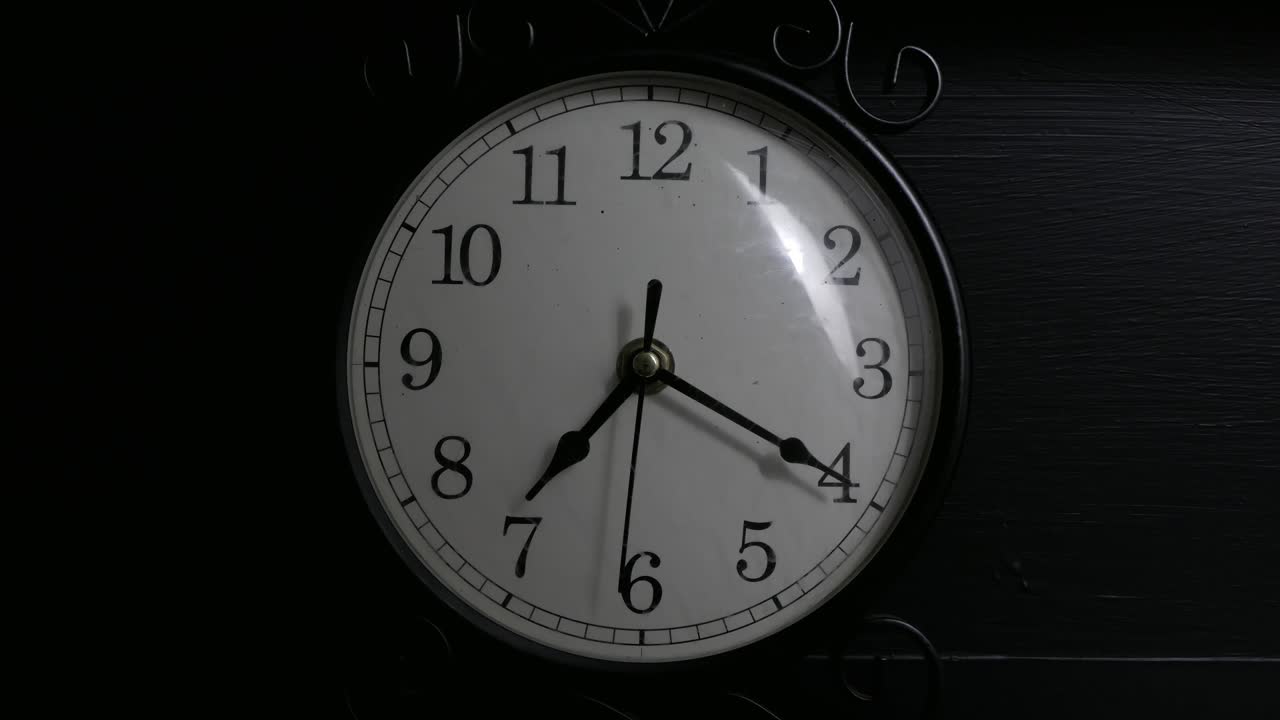 Time-lapse Of A Small Black Clock In A Dimly Lit Room Free Stock Video ...