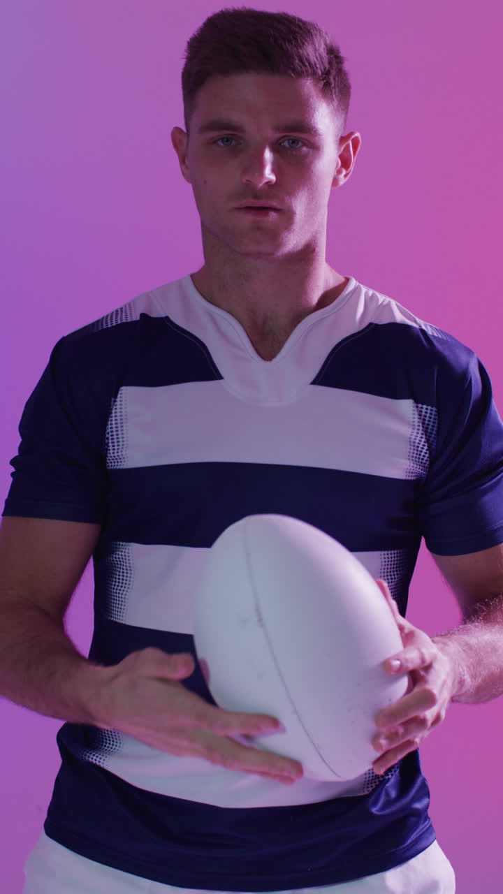 Vertical video of portrait of caucasian male rugby player with rugby ...