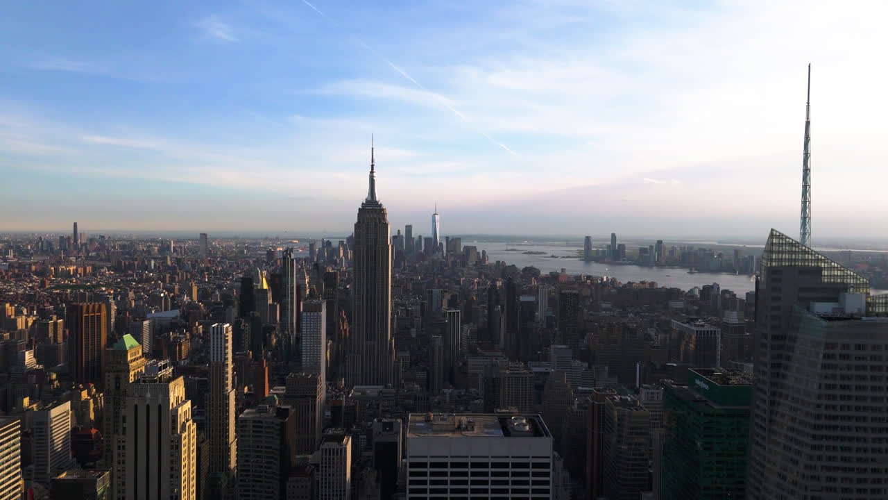 Aerial tracking shot of the Midtown and Lower Manhattan, golden hour in ...